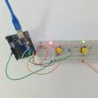 Light up two LEDs connected to Arduino using push buttons